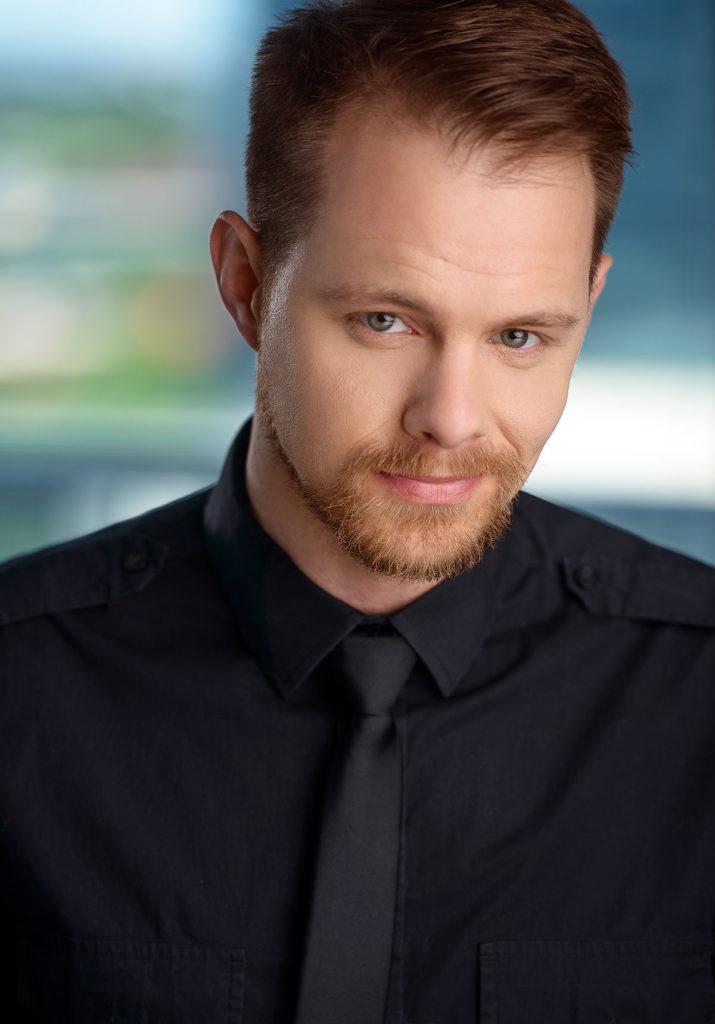 BlackShirtAndTie-Smirk – Bryan McClure – Actor | Producer | Writer | Web Designer | Creative